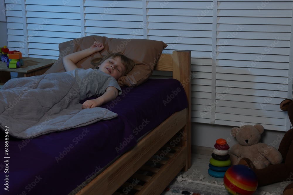 Little boy snoring while sleeping in bed at night Stock Photo | Adobe Stock
