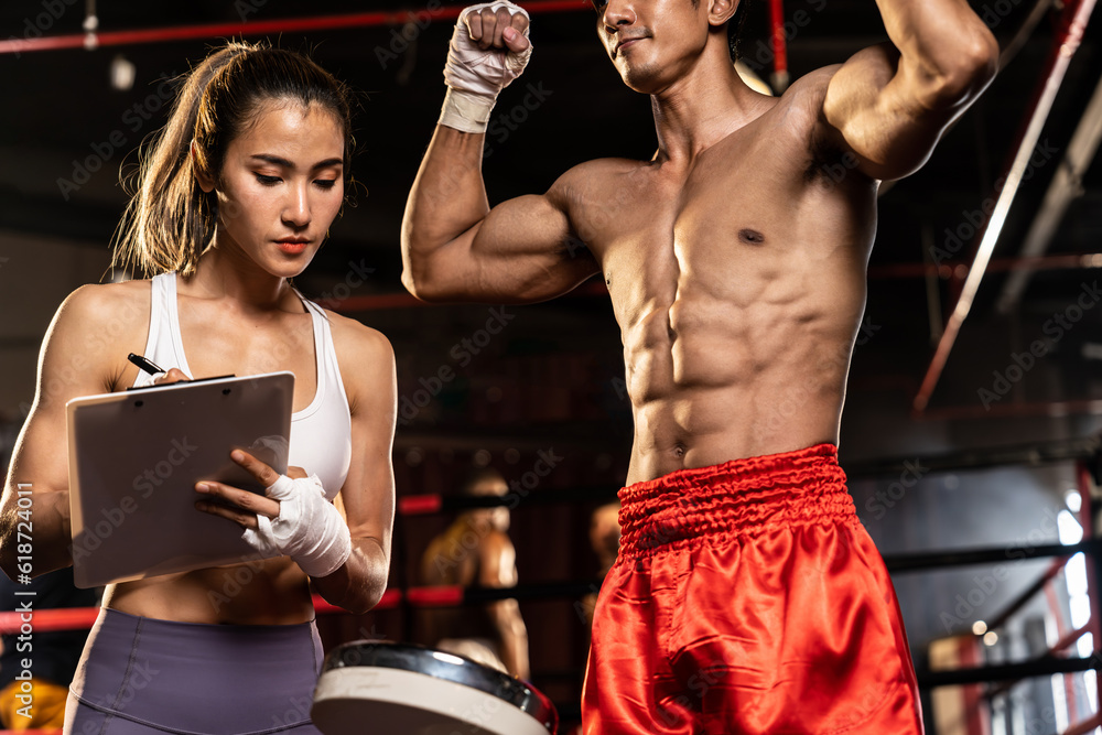 Muay Thai boxer step on weight scale for boxing class designation by ...