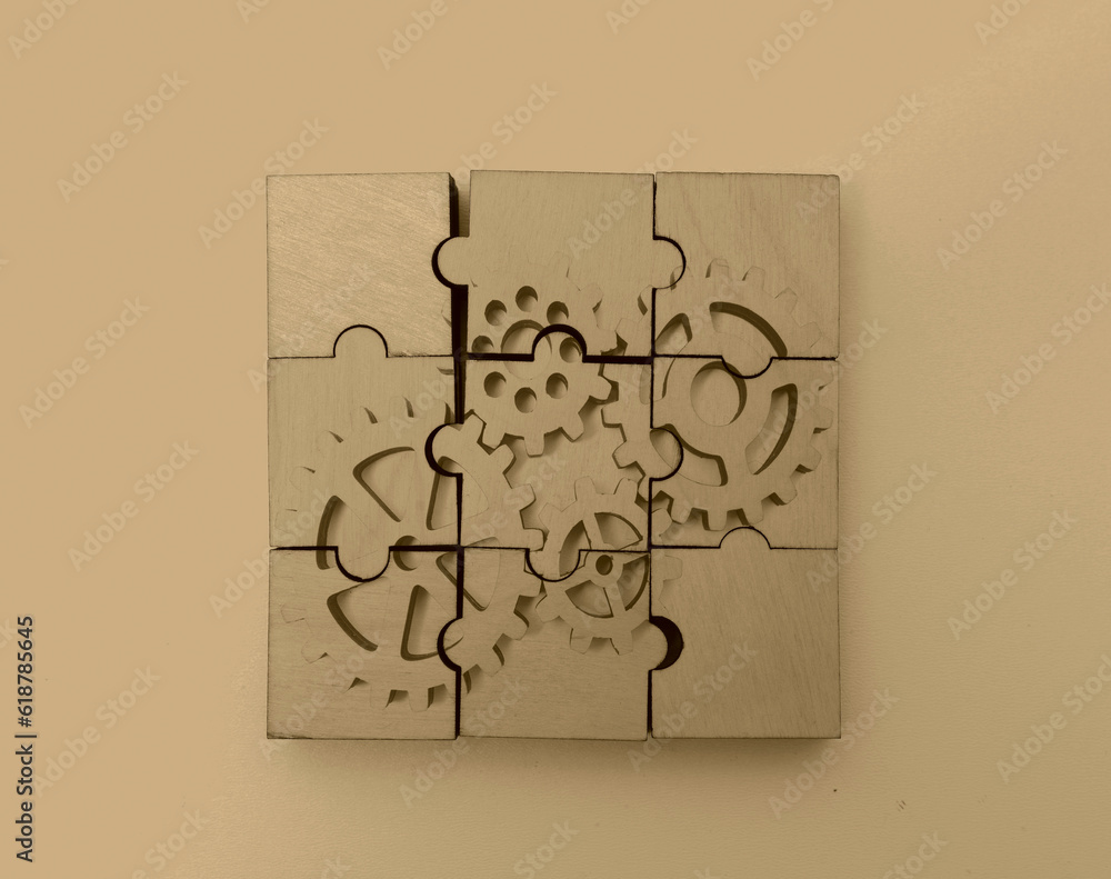 solving the problem concept - puzzles and cogwheels. wooden gears under ...