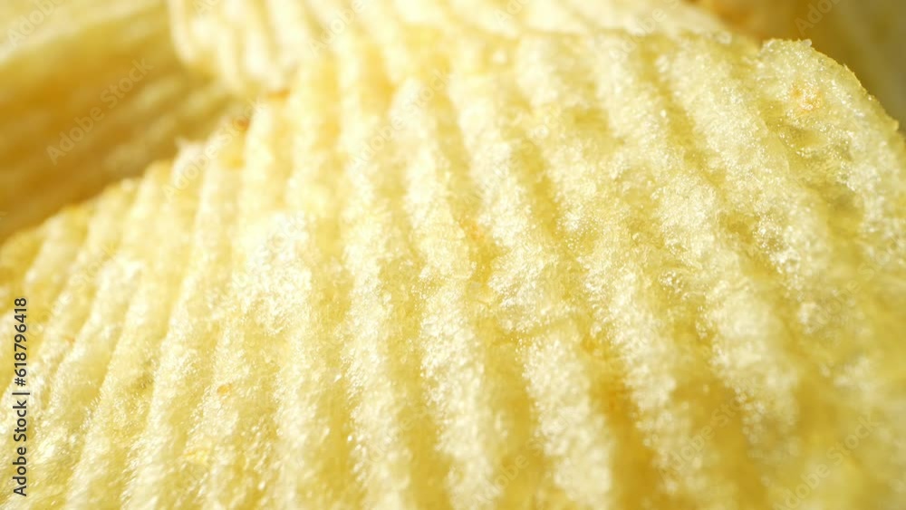 Macro video showcasing wavy potato chips with a probe lens captures ...