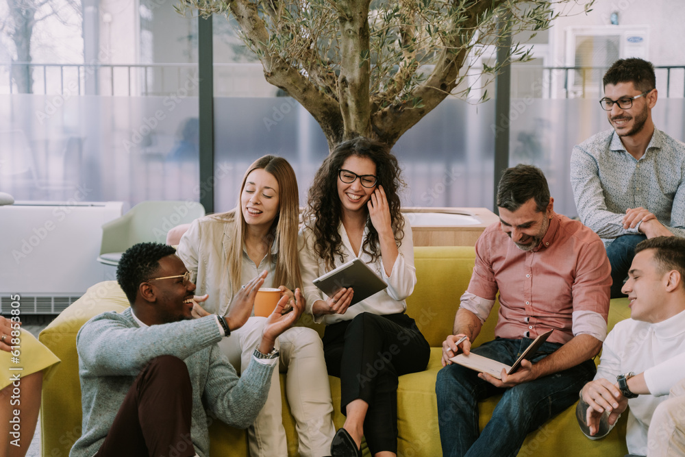 Black male business person joking with his senior Caucasian colleague ...