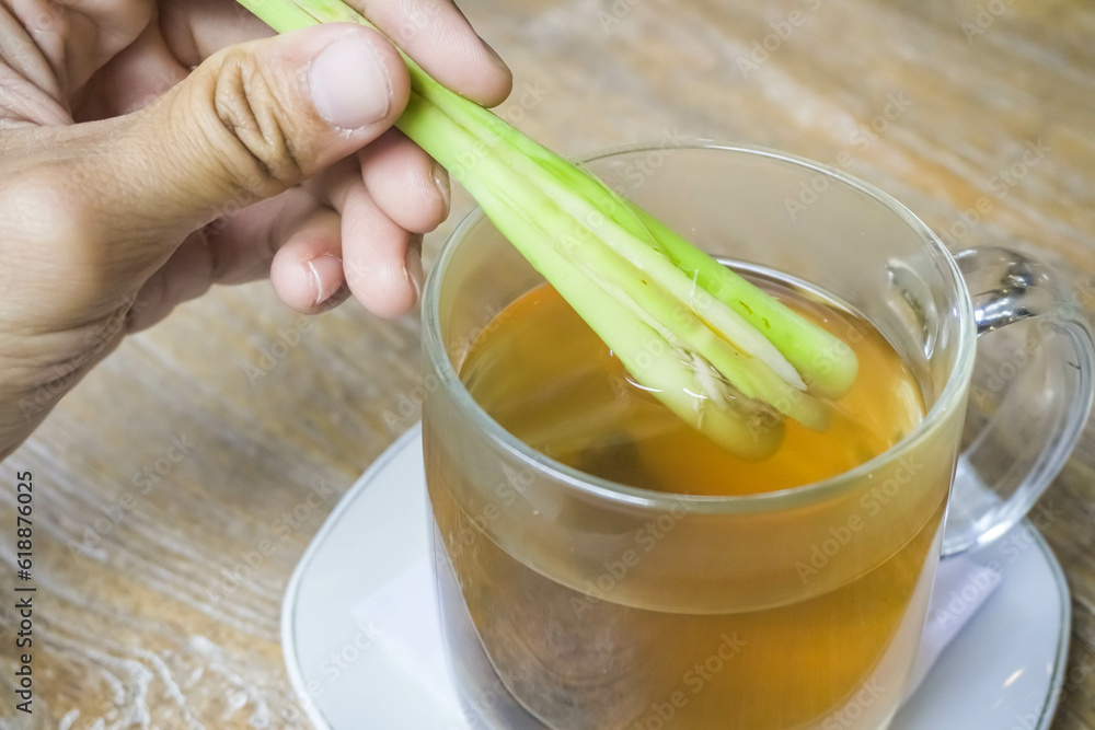 Wedhang Jahe Sere in a glass or Hot Lemongrass Ginger drink is a ...