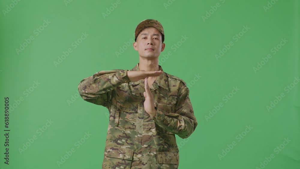 Asian Man Soldier Looking At Camera And Showing Time Out Hands Gesture ...