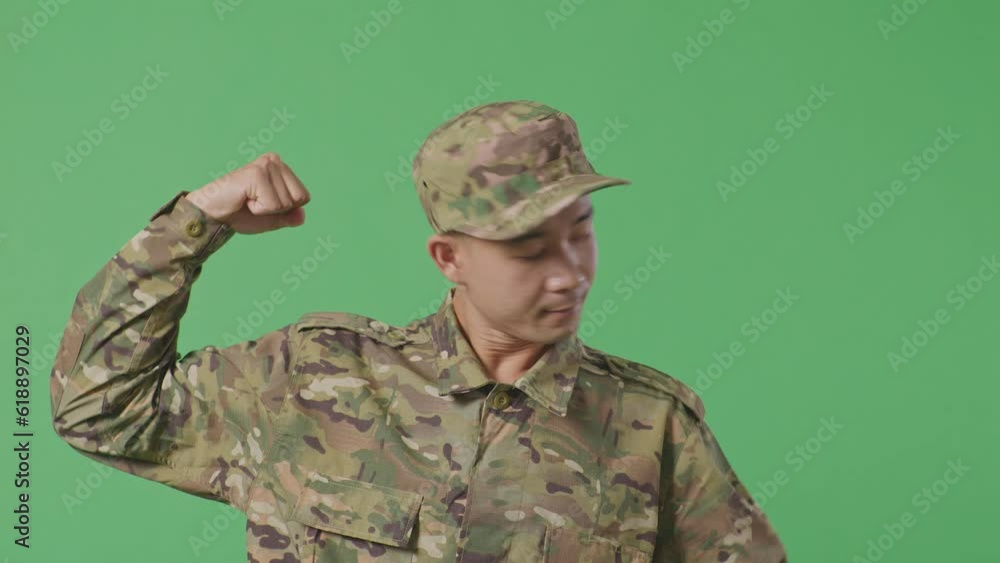 Close Up Of Asian Man Soldier Smiling And Flexing His Bicep While ...