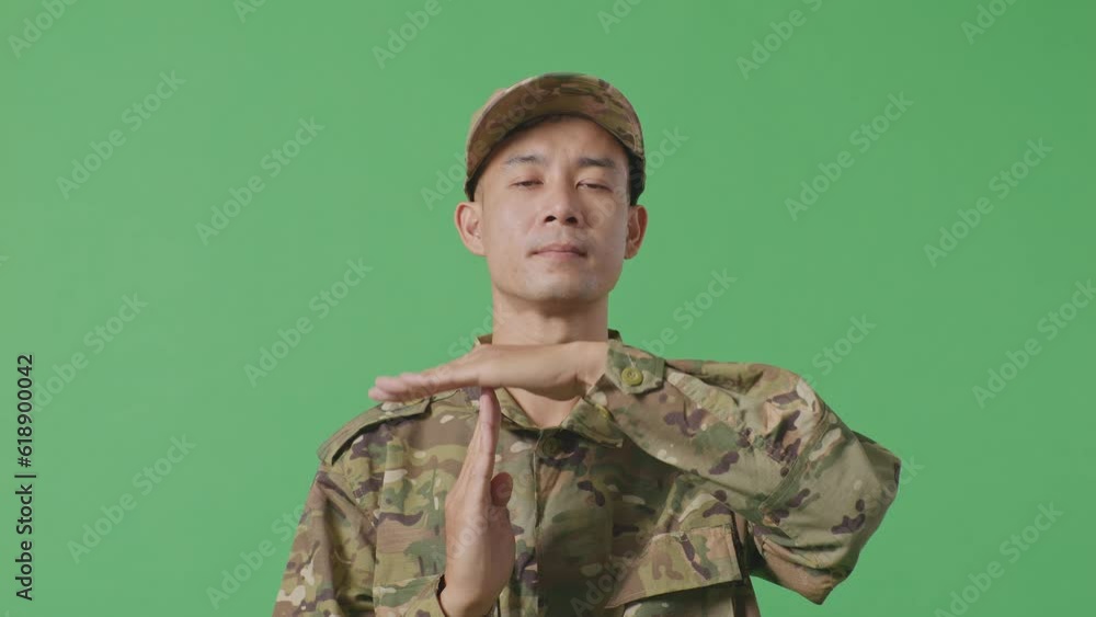 Close Up Of Asian Man Soldier Looking At Camera And Showing Time Out ...
