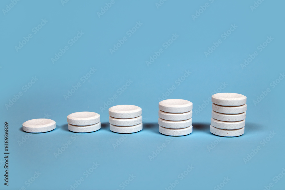 Effervescent tablets stack on a pastel blue background Stock Photo ...
