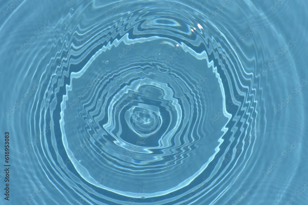 Blue water with ripples on the surface. Defocus blurred transparent ...