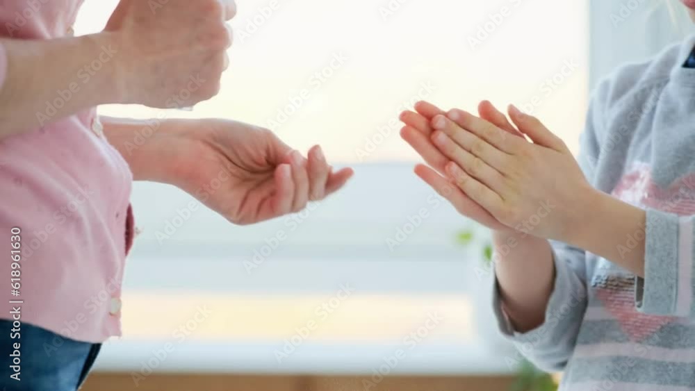 parent spray hand on his child hand sanitizer to cleaning hands hygiene ...