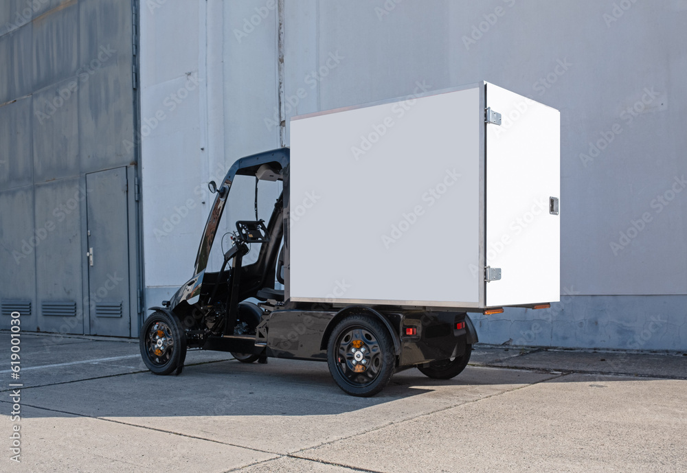 A modern electric delivery 4-wheel Quadracycle bike with a blank white ...