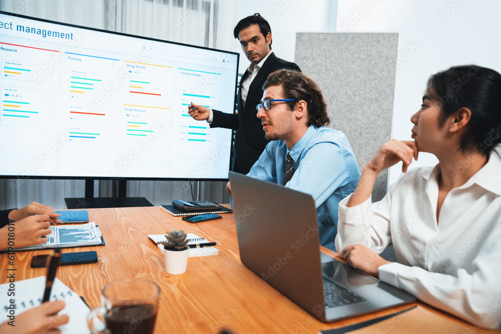 Project manager planning schedules for business task at meeting room ...