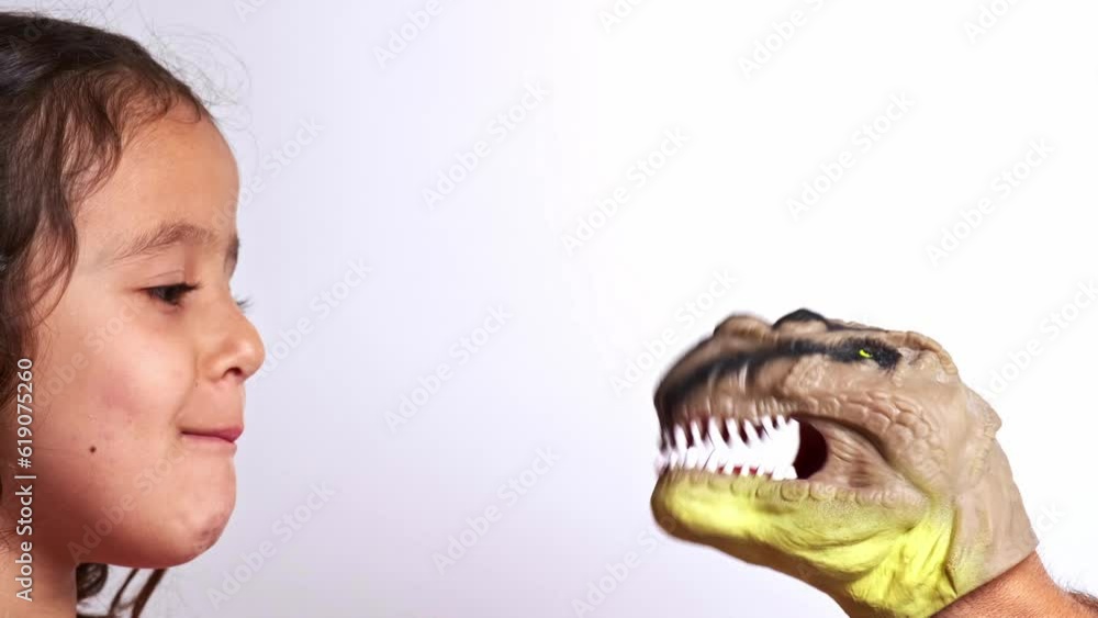 six-year-old girl in profile who is surprised by a tyrannosaurus rex ...