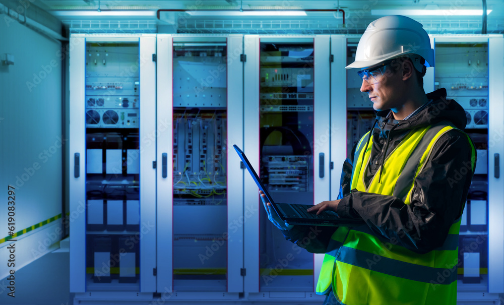 Modern factory engineer. Manufactory worker man with laptop. Server ...