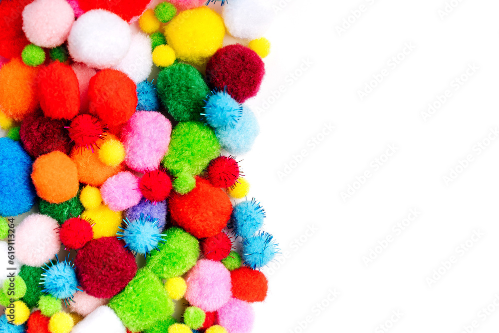 Colorful pom-poms for children's crafts. Different multi-colored ...