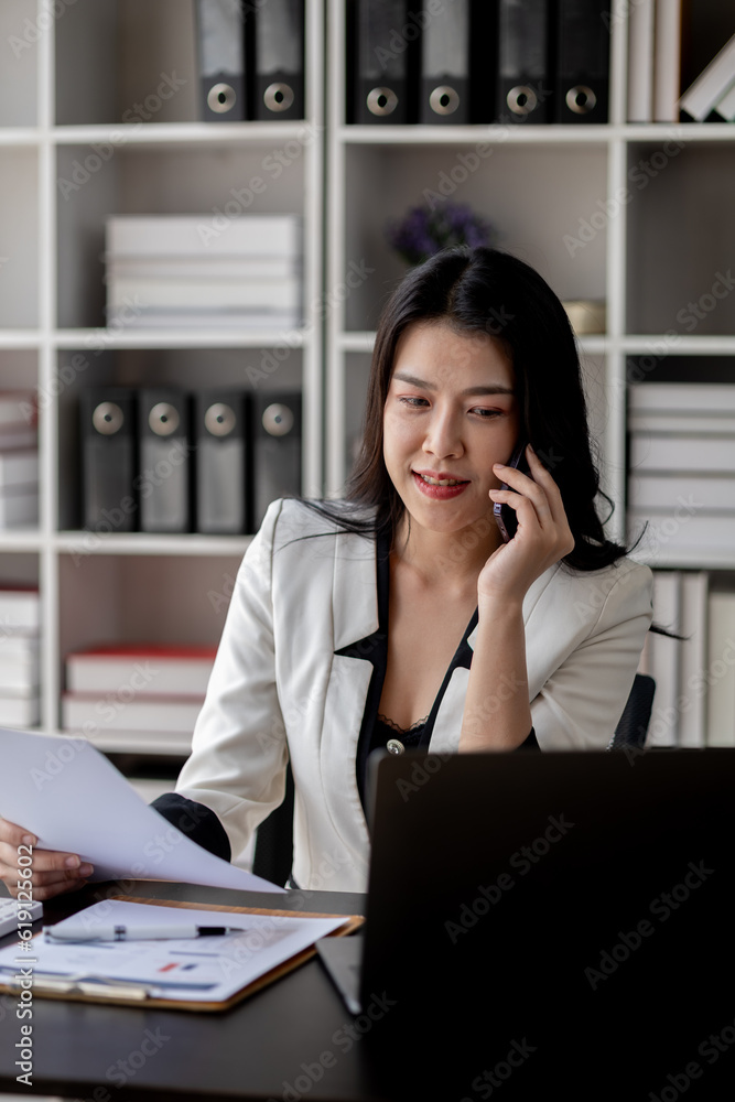 Beautiful asian woman talking on the phone, businesswoman working in ...