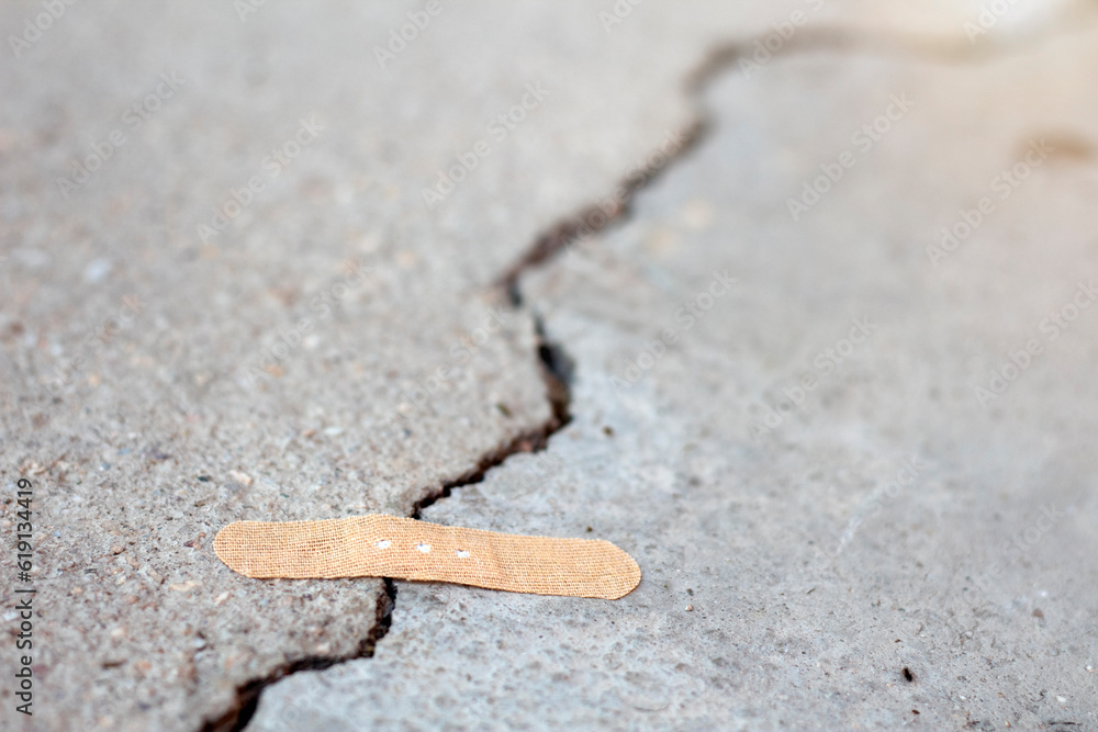 Broken asphalt roads, caused by earthquake. A large crack in concrete ...