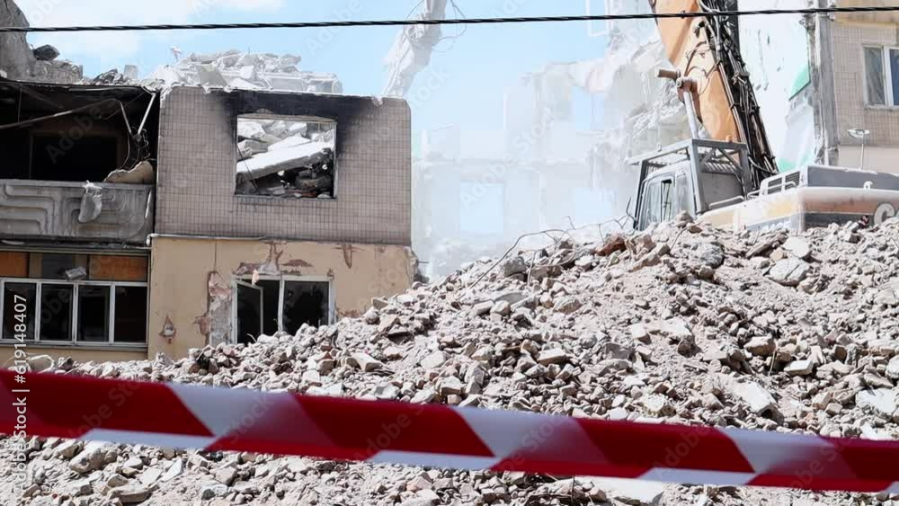 Construction work on the demolition of multi-storey apartments. Fence ...