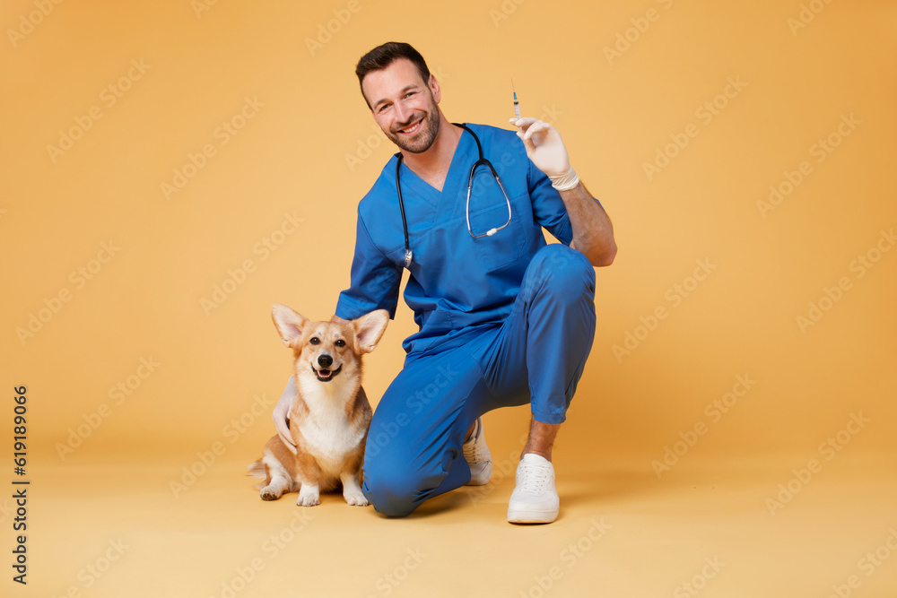 Veterinary clinic service. Friendly man nurse in uniform and with ...