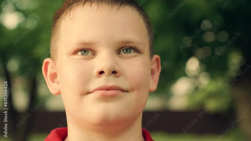 Beautiful kid look outdoor. Boy child raises head and looks up ...