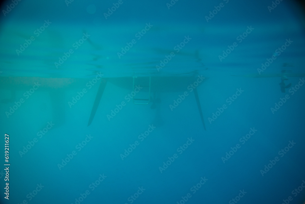 Underwater view of the propellers of a yacht in the blue water of Sea ...