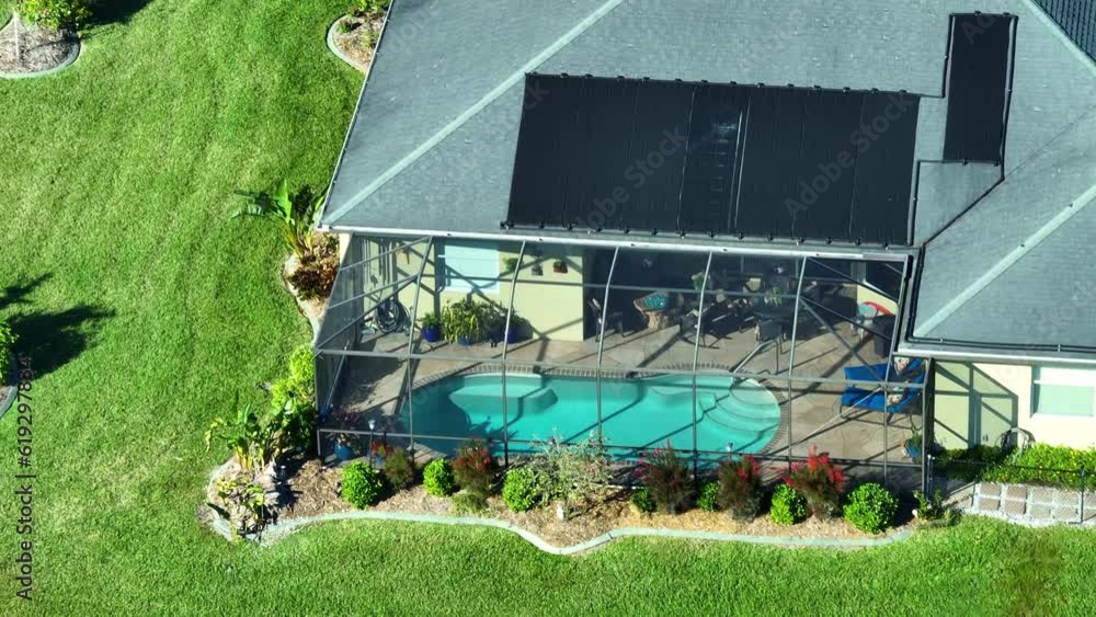 Plastic solar heating panels installed on rooftop of a private house ...