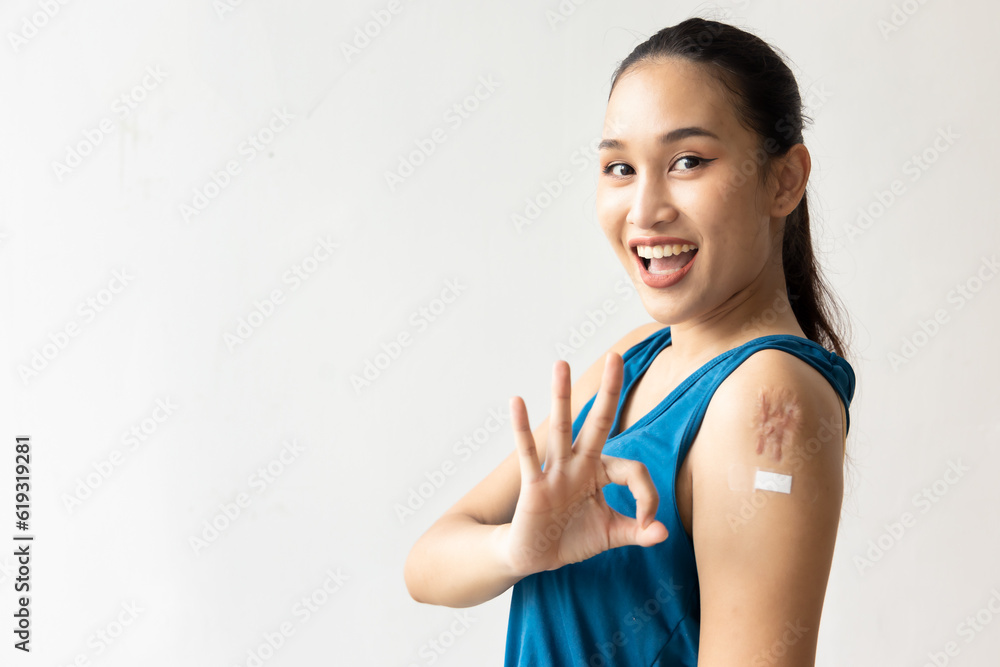 Happy smiling healthy Asian Woman Receiving Vaccine Shot, bandage on ...
