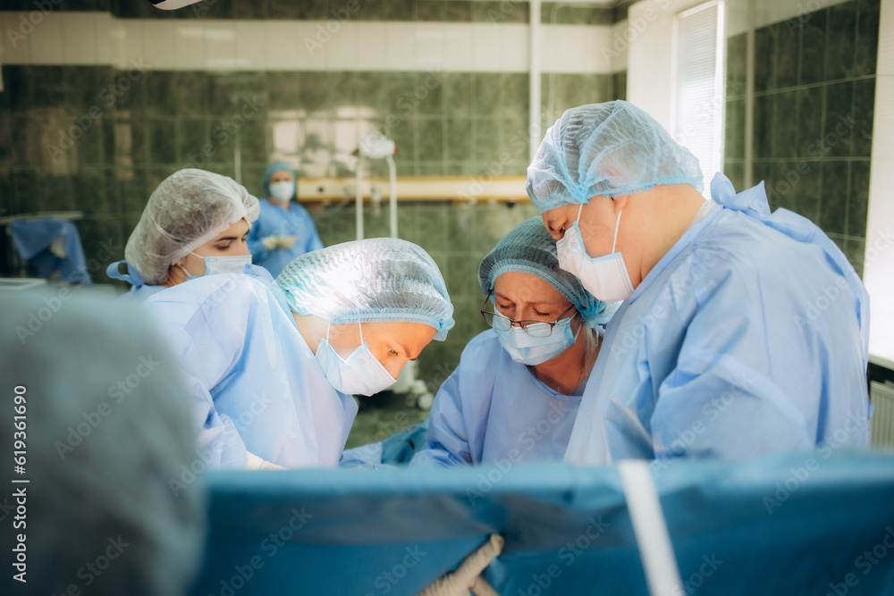Poster surgeons perfoming surgery operation of abdominal cesarean ...