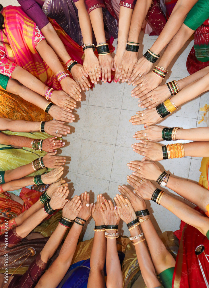 An Elegant picture of a Hindu Wedding ritual where a group of ladies ...