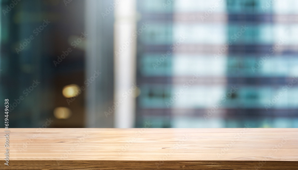 Wood table top on blur glass window wall building background. For ...