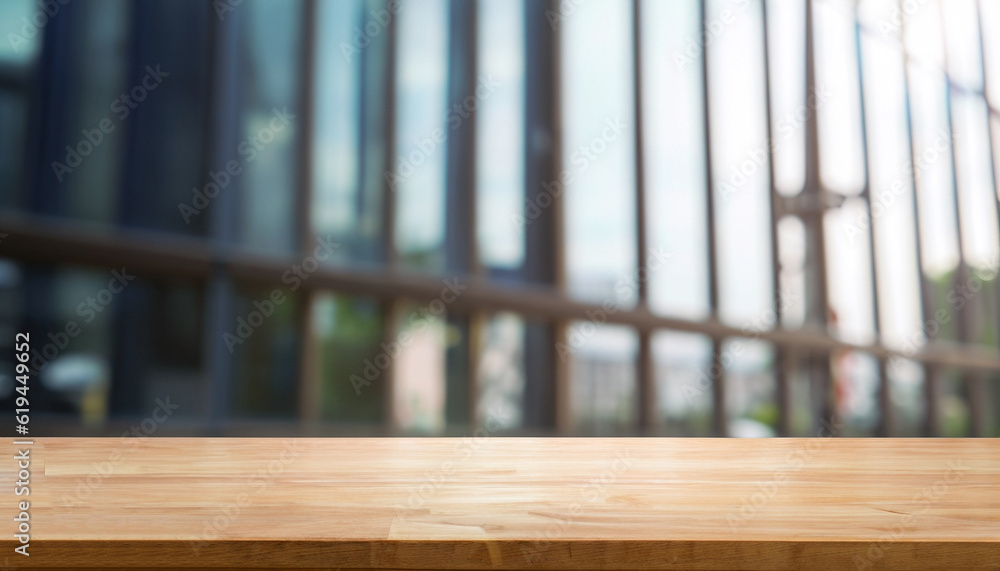 Wood table top on blur glass window wall building background. For ...