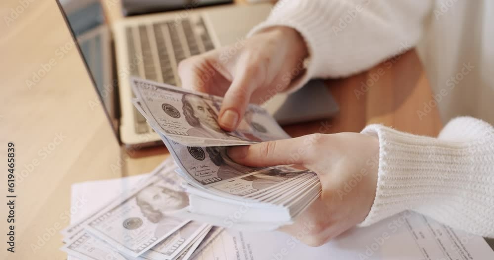 Corrupt money system. Stressed young woman calculating monthly home ...