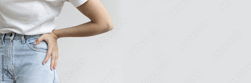 Asian Woman in Distress, Dealing with hip pain, work-related pelvic ...