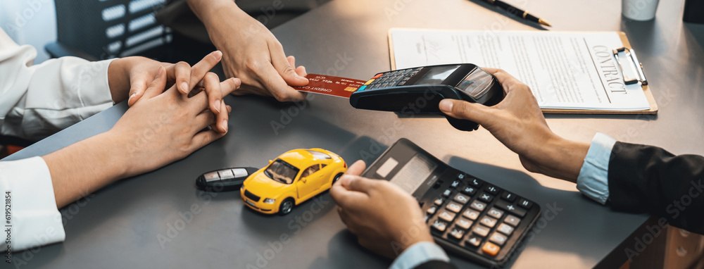 Customer client purchases new car with credit card via electronic ...