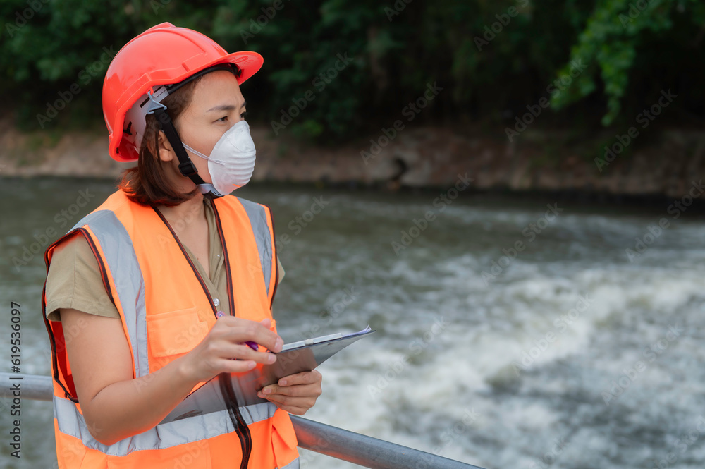 Asian Female engineering working . at sewage treatment plant,Marine ...