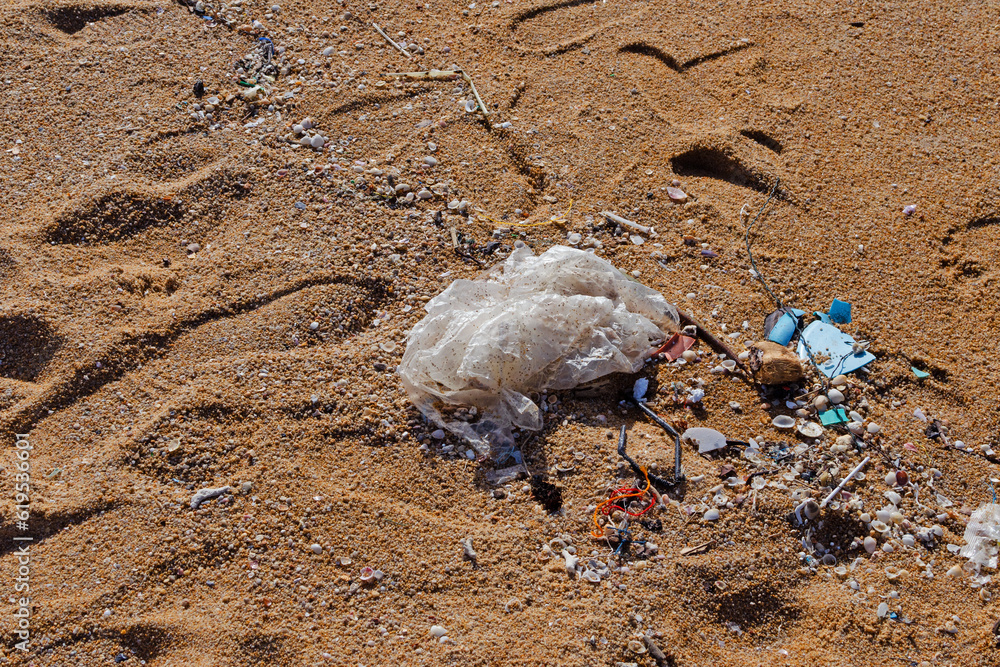 Plastic bag are left on the beach as waste polluting nature, Plastic is ...