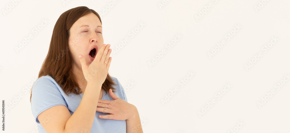Tired woman yawning covering open mouth with hand need rest. Young ...