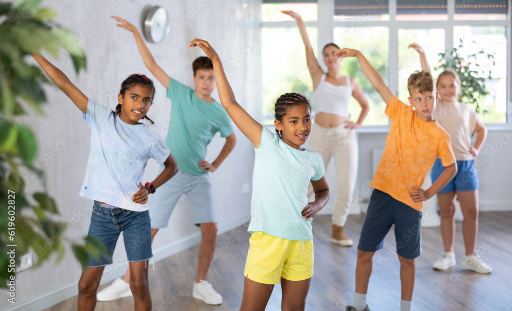 Positive African female child dances vogue in choreographic school ...