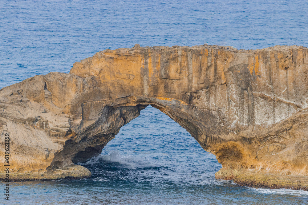 Arecibo rock formations with an arc shape landscape in the coast of ...