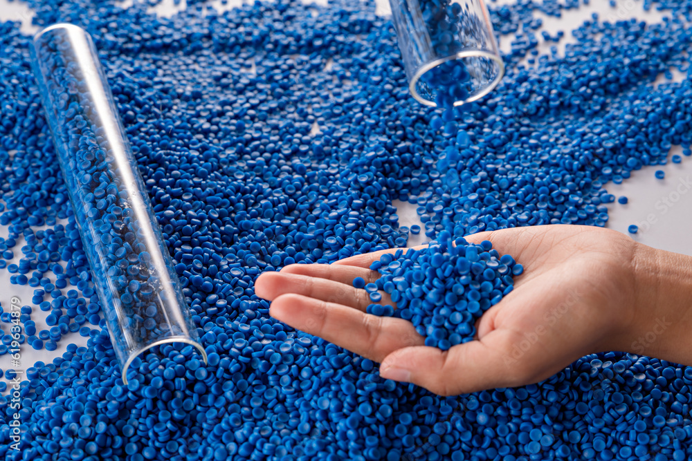 White plastic grain, plastic polymer granules,hand hold Polymer pellets ...