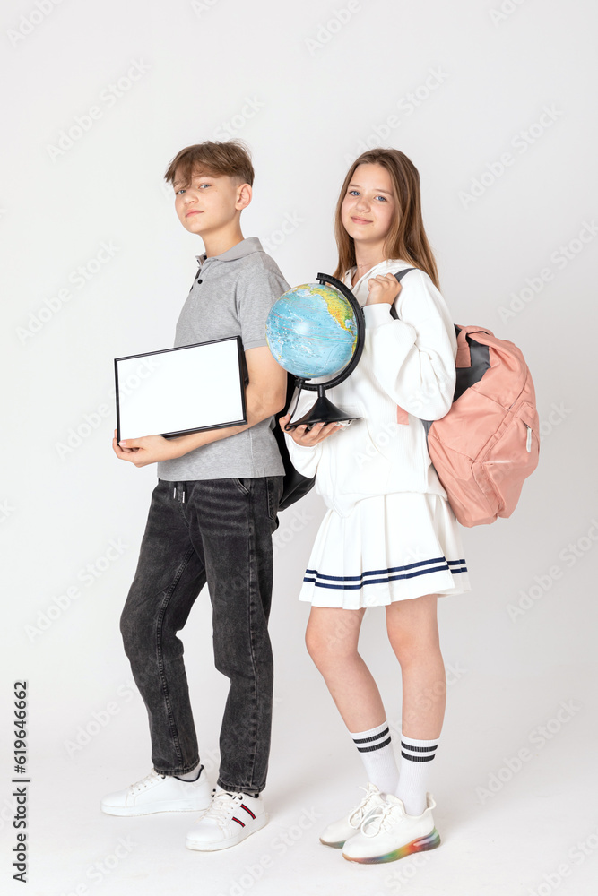 Back to school. Two schoolchildren, teenagers with backpacks and school ... Back to school. Two schoolchildren, teenagers with backpacks and school ...