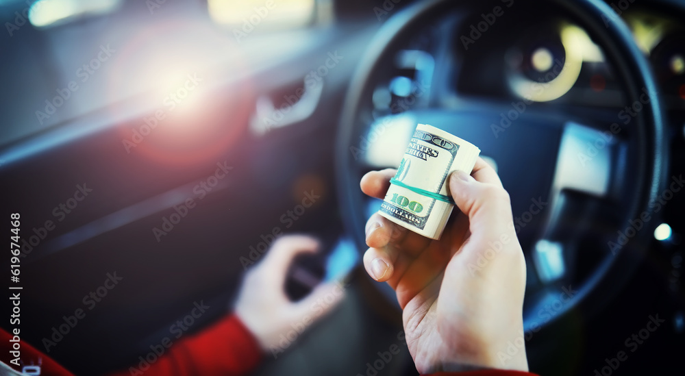 Concept background. dollars with a car key lie in inside cars ...