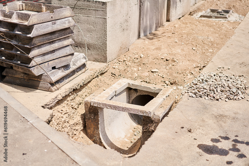 Laying concrete manholes and drain pipes for stormwater system ...