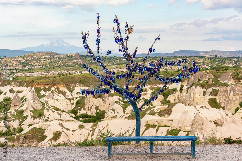 Wish tree with blue glass evil eyes (nazar boncugu) signs. Cappadocia ...
