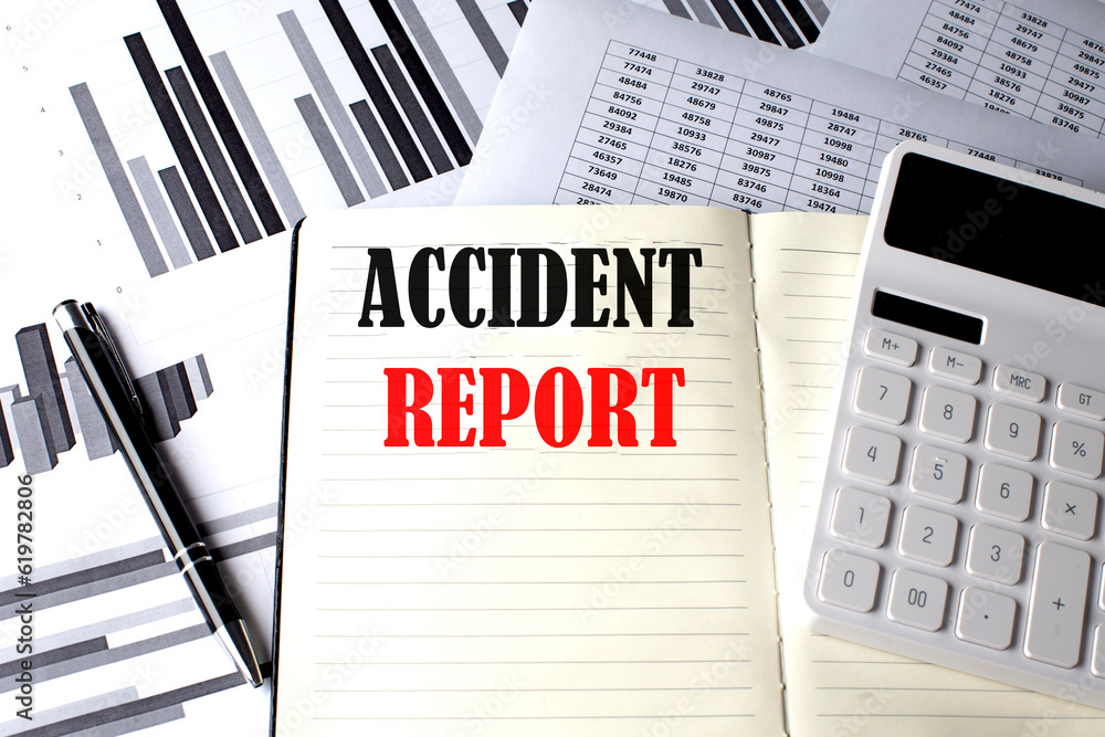 ACCIDENT REPORT text written on a notebook on chart and diagram Stock ...