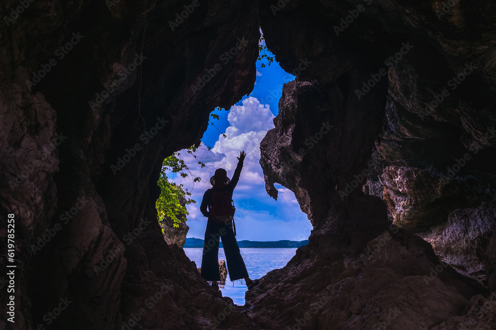 Traveler woman standing in front of cave entranc joy nature view scenic ...