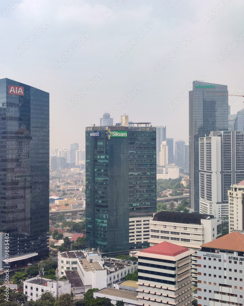 Jakarta cityscape with AIA red white and Siloam Hospital MRCCC and ...