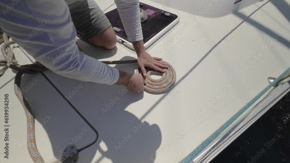 Close-up footage of sailboat ropes, pulleys and ropes on the mast. A ...