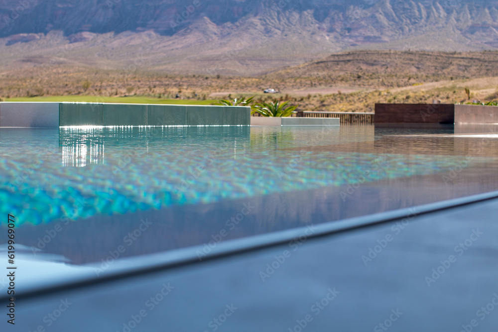 Beautiful high-end custom swimming pool overlooking a golf course with ...