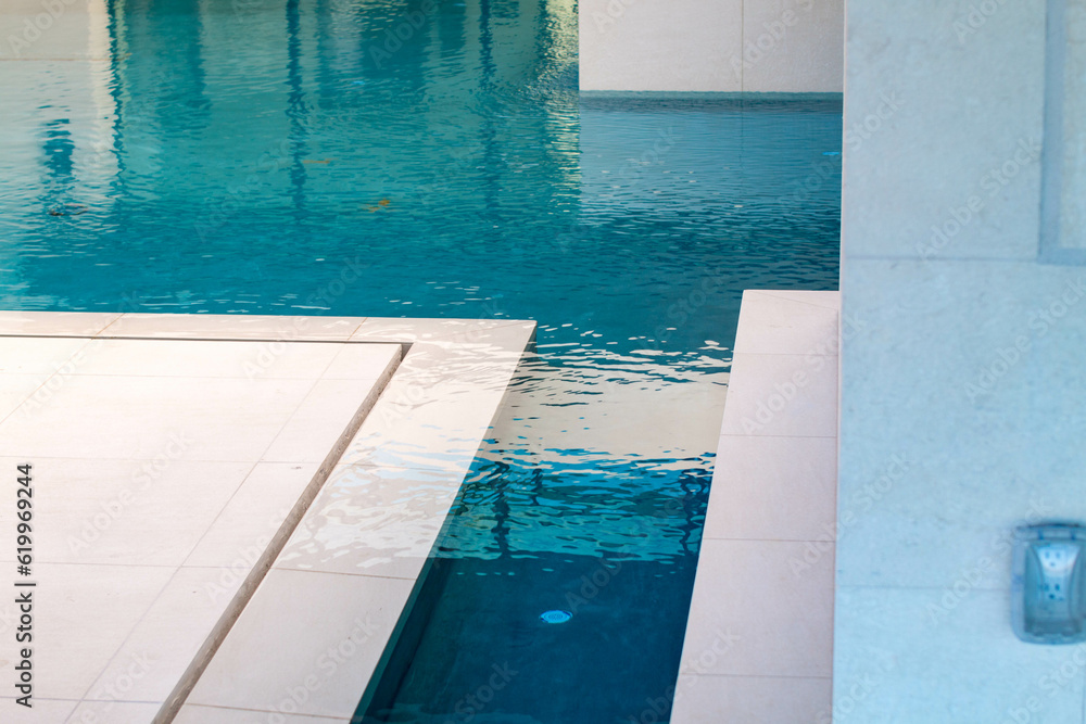 Beautiful high-end custom swimming pool overlooking a golf course with ...