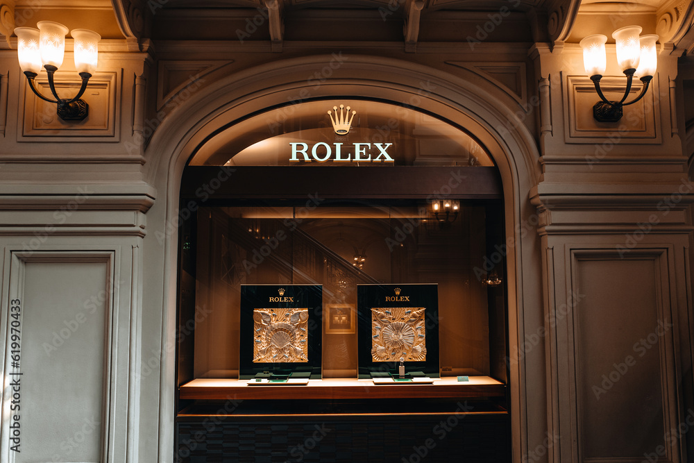 Facade of Rolex watch store in famous shopping mall GUM. Golden crown ...