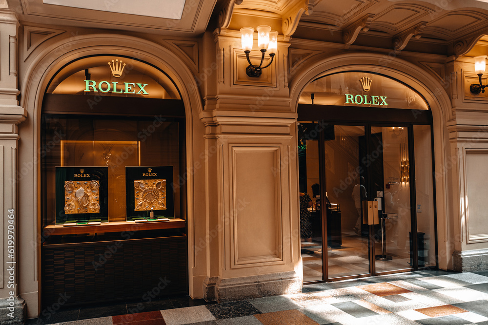 Foto de Facade of Rolex watch store in famous shopping mall GUM. Golden ...